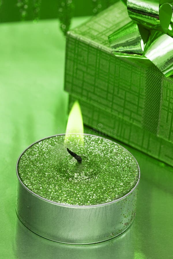 Burning Candle and Gift Box Stock Image - Image of green, color: 3838309