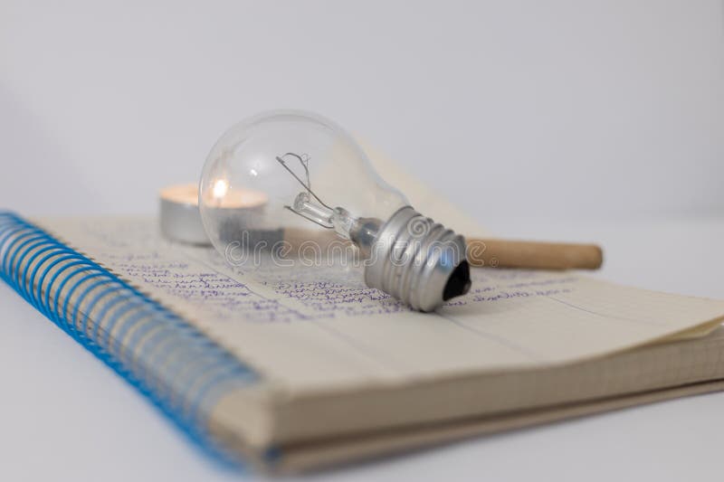 Burning Candle and Lamp on a Children S Notebook Stock Photo - Image of ...