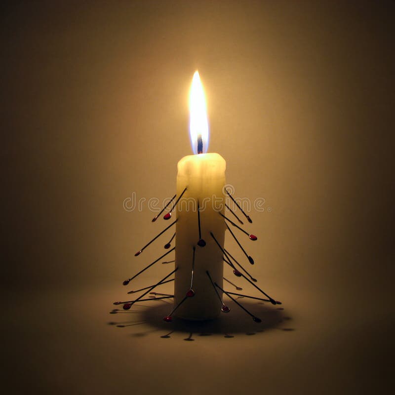 Burning Candle Larded with Needles Stock Image - Image of needles ...