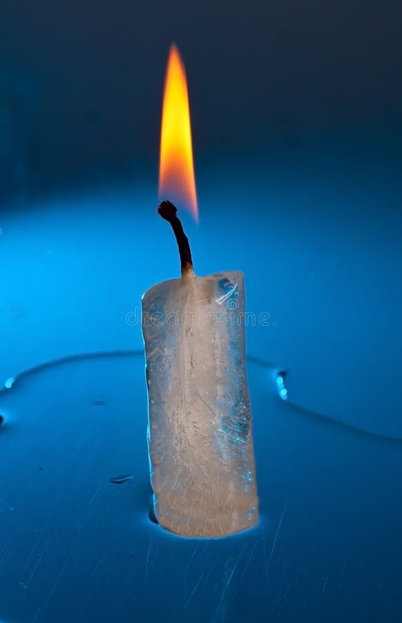 Burning candle made of ice stock image. Image of yellow - 24478061