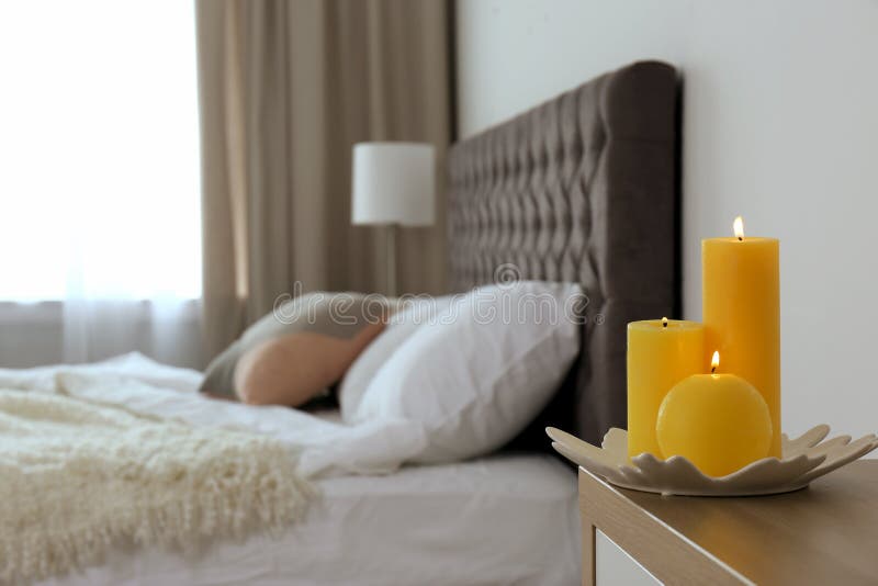 Burning Candles on Bedside Table Stock Image - Image of decoration ...
