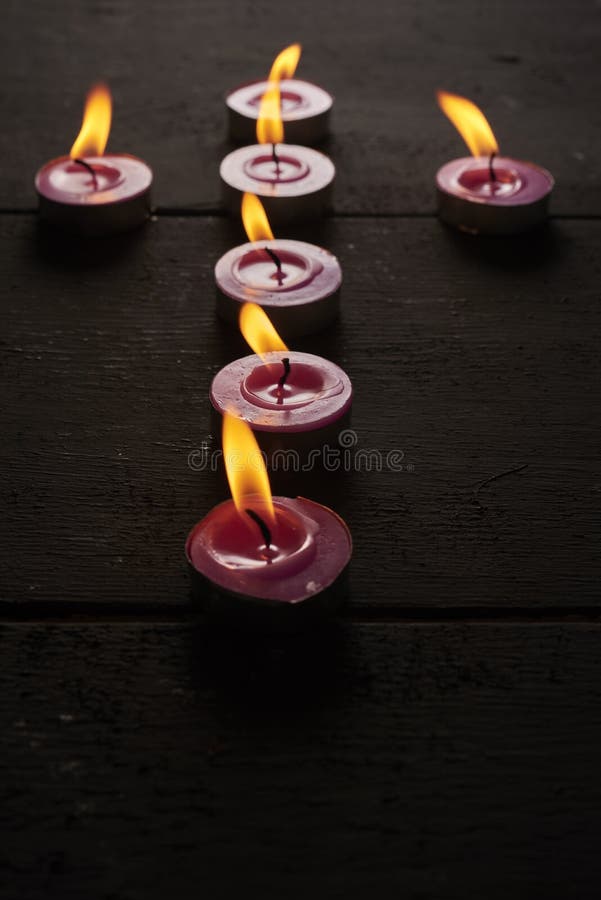 Burning candles at night stock photo. Image of fire, polished - 76799028