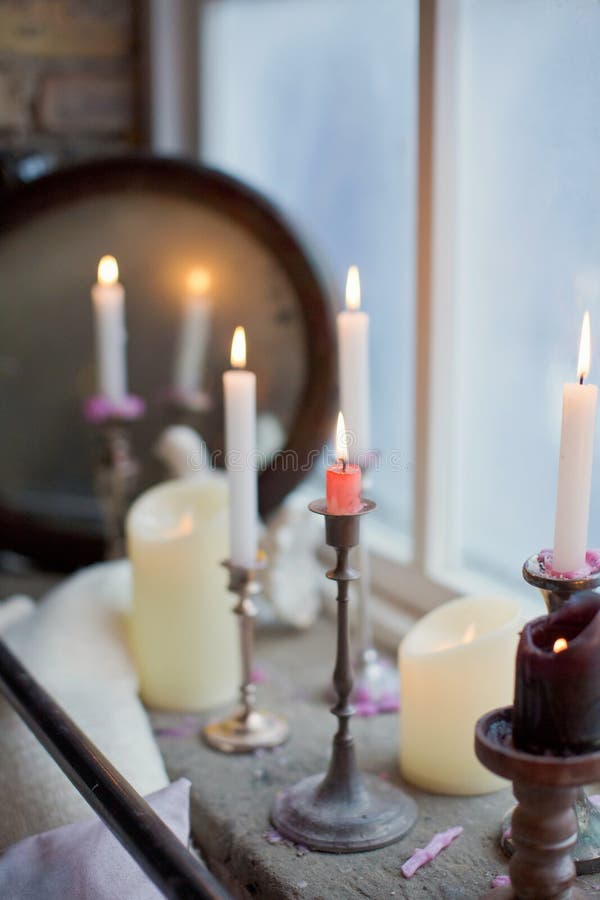 Burning Candles in Silver Candlesticks Stock Photo - Image of glowing ...