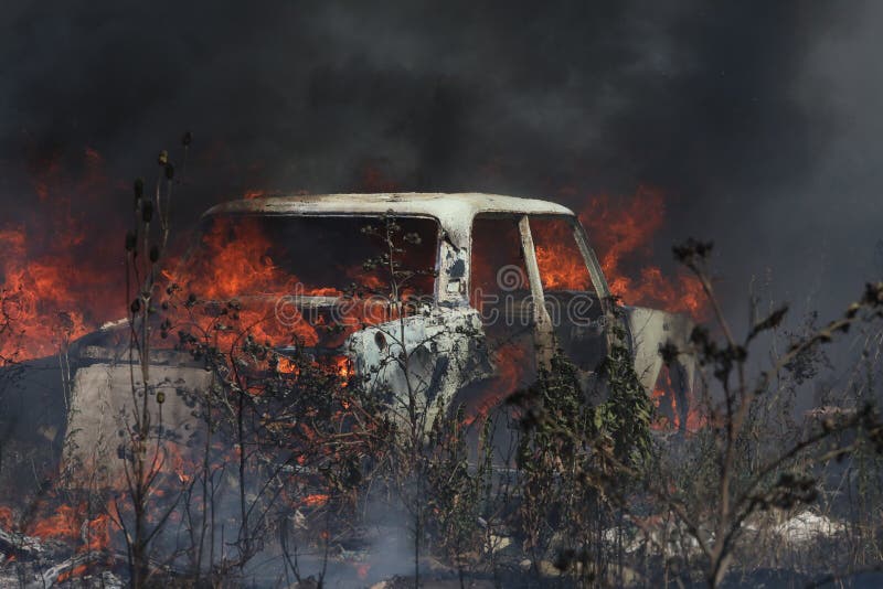 Burning car in a field stock photo. Image of fireplace - 226223384