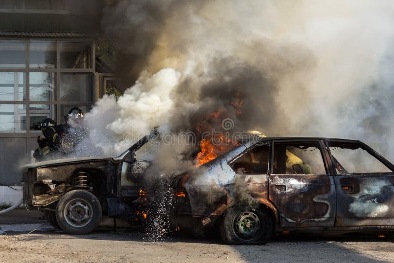 Cars Burning stock image. Image of crew, douse, asphalt - 22878085