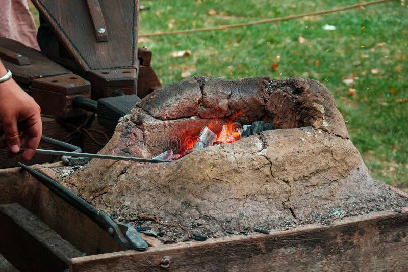 Bellows of the Blacksmith Fanning the Fire in the Coals Stock Photo ...