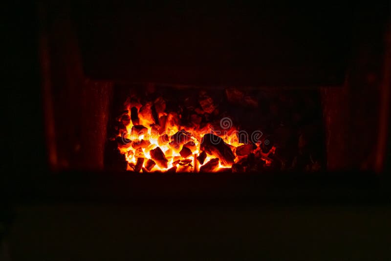 Burning Coals in a Solid Fuel Boiler. Heating of a Residential Building ...