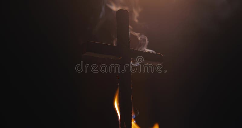 Burning cross falling down stock footage. Video of doom - 246939818