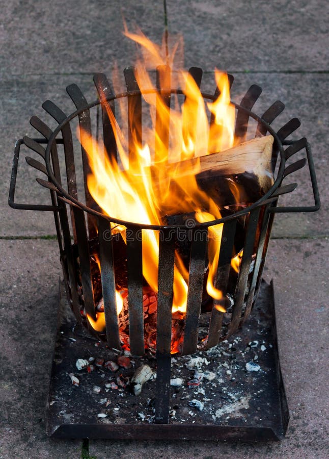 Burning fire basket stock photo. Image of garden, bright - 25129116