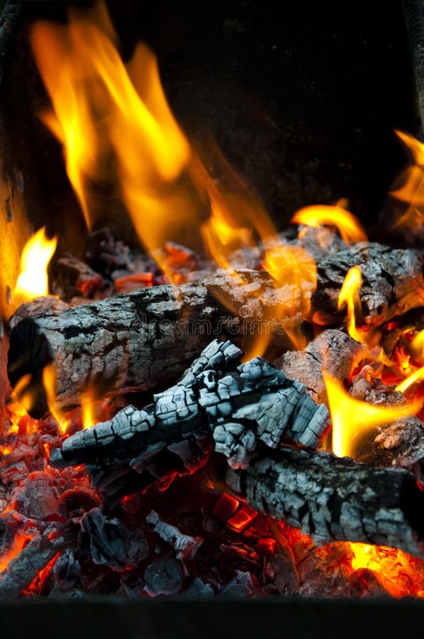 Burning Fire Wood and Smoldering Embers Close View Abstract Background ...