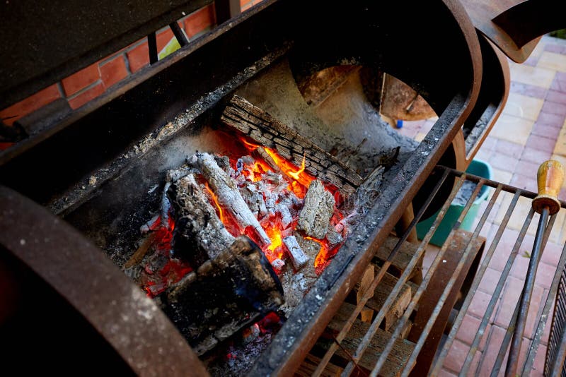 Burning Firewood in the Barbecue at Backyard Close Up. Stock Image ...