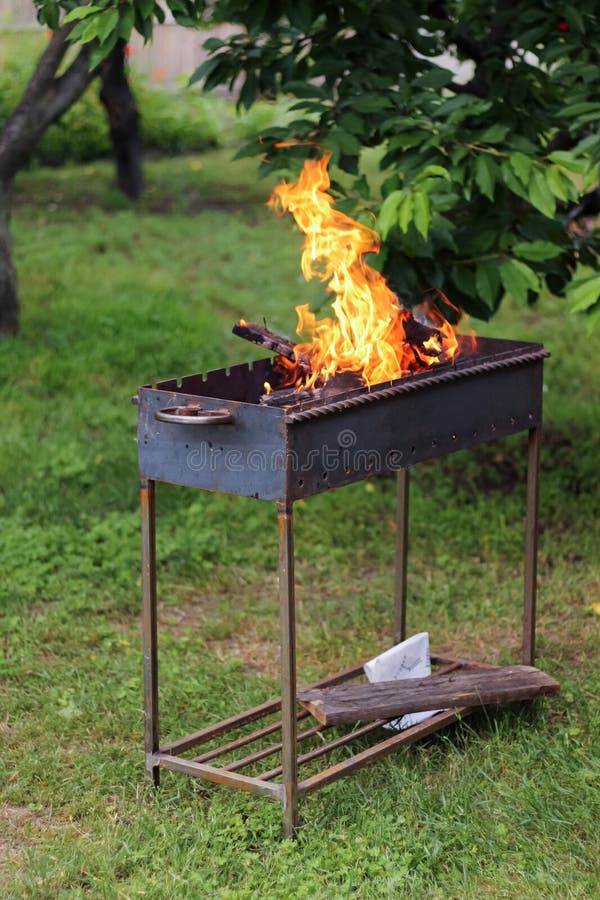 Burning Firewood in a Barbecue for Cooking Outdoor Stock Image - Image ...