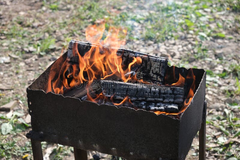 Burning Firewood in an Old Rusty Grill Stock Image - Image of wood ...