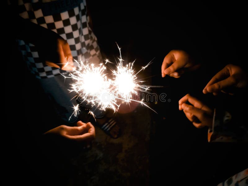 Burning Fireworks in Hands Outdoors Stock Image - Image of light, brand ...