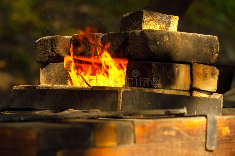 A Burning Forge Made of Bricks in Nature Stock Photo - Image of glowing ...