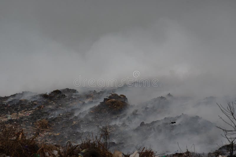 A Burning Garbage Dump. Smoke from a Burning Pile of Garbage Stock ...