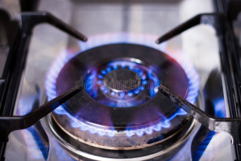 Flames on gas cooker hob stock image. Image of heating - 31025843
