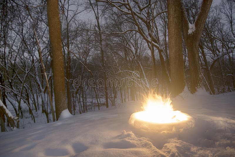 Burning Hot Fire Surrounded by Snow in Wooded Area. Stock Photo - Image ...