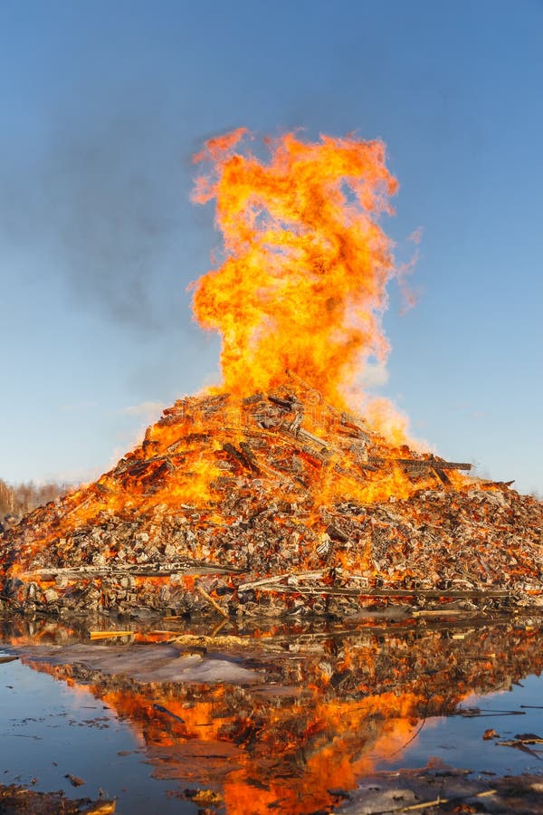 Burning Huge Bonfire Against the Blue Sky Stock Image - Image of ...