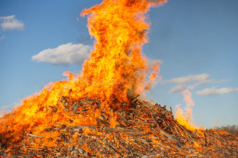 Burning Huge Bonfire Against the Blue Sky Stock Photo - Image of huge ...