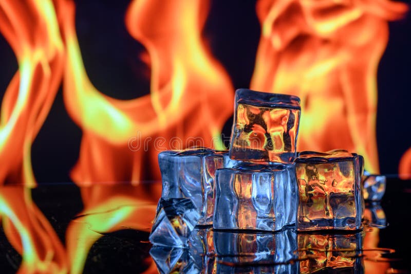 Ice Cubes Against the Background of Fire, Fire and Ice, 2 Stock Photo ...