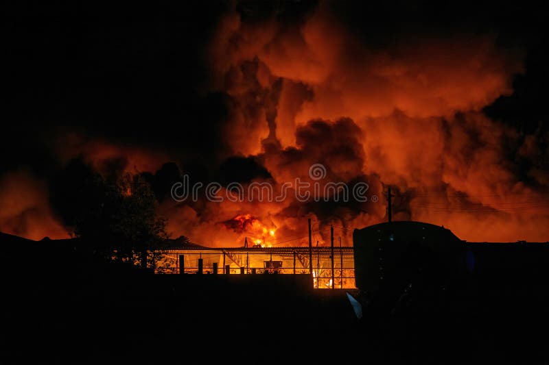 Burning Industrial Building. Big Blaze and Smoke at Night Stock Image ...
