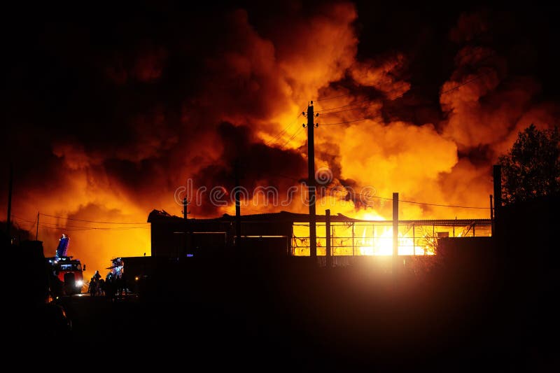 Burning Industrial Building. Big Blaze and Smoke at Night Stock Photo ...