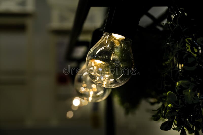 Burning Light Bulbs on a Dark Background Stock Photo - Image of glow ...