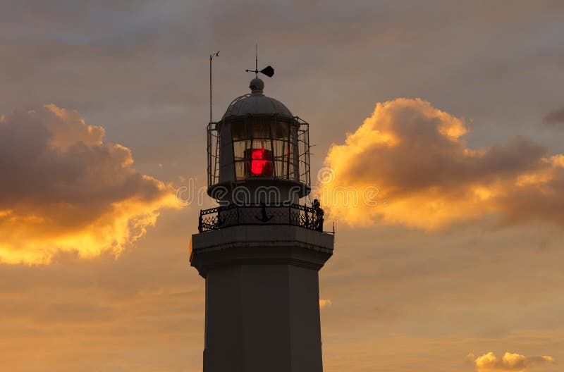 Burning Lighthouse Against the Background of the Twilight Sky. Stock ...