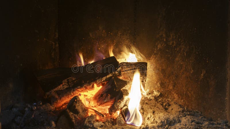 Burning Logs in a Cozy Fireplace. Fire Background Stock Photo - Image ...