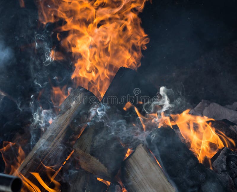 Burning logs in a fire stock photo. Image of rustic - 368044716