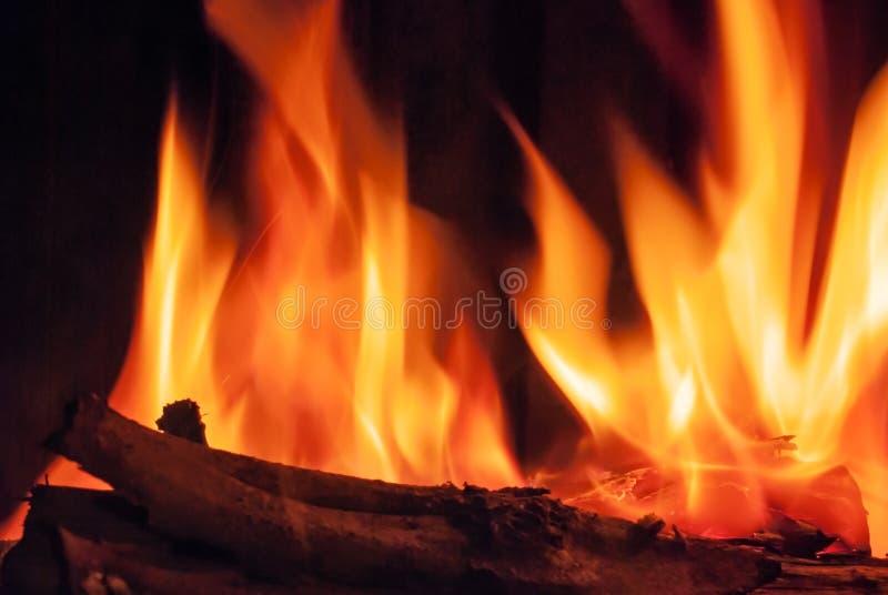 Burning Logs stock photo. Image of flame, energy, fireplace - 294710