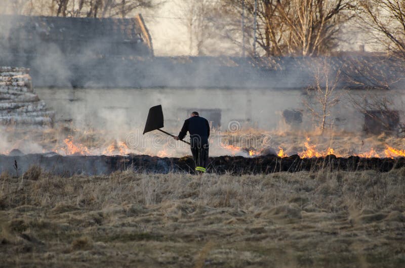 Burning Old, Dry Grass Field in the Spring, Firefighters Work Editorial ...