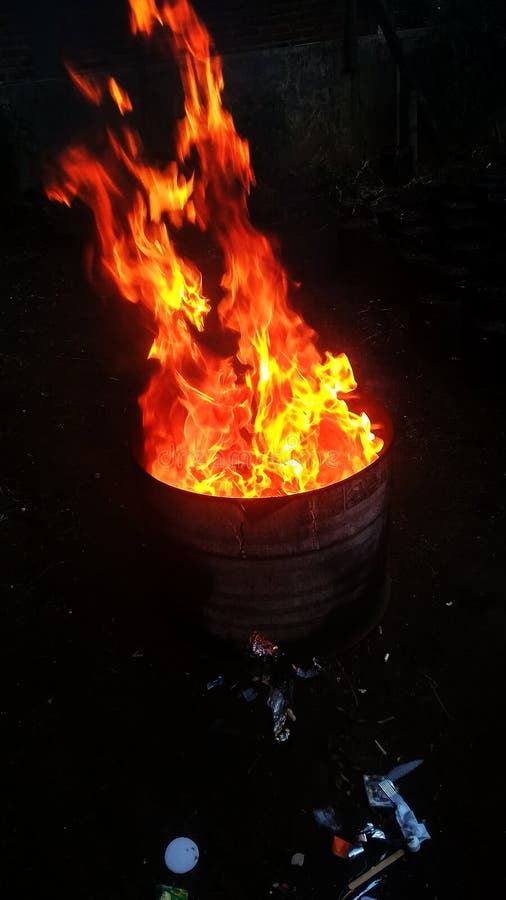 Burning Plastic Waste in Barrels To Create a Clean Environment Stock ...