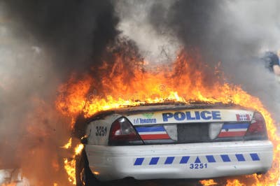 Burning police car. editorial stock image. Image of city - 26745644
