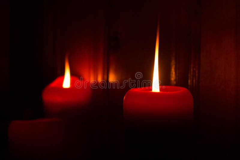 Burning Red Candles stock image. Image of glow, burn - 64333843