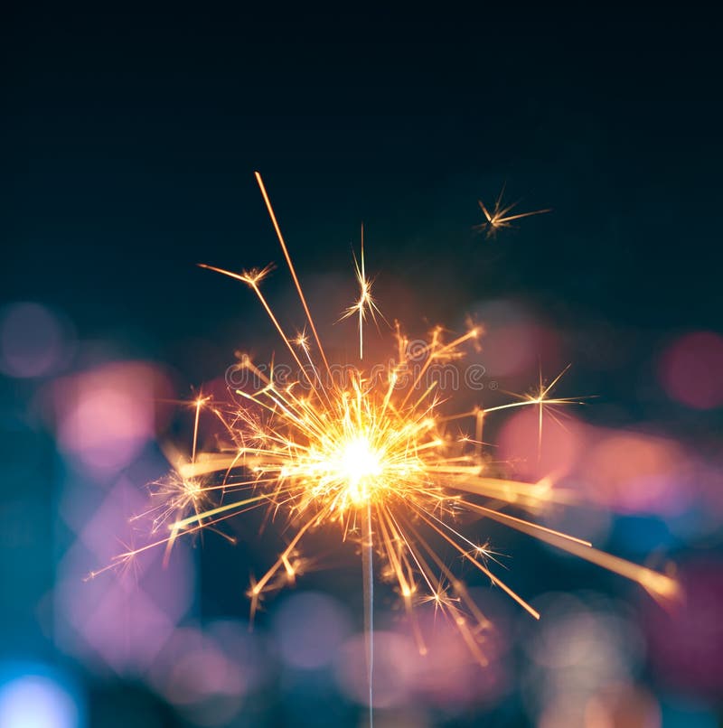 Burning Sparkler with Blurred Background Stock Photo - Image of ...