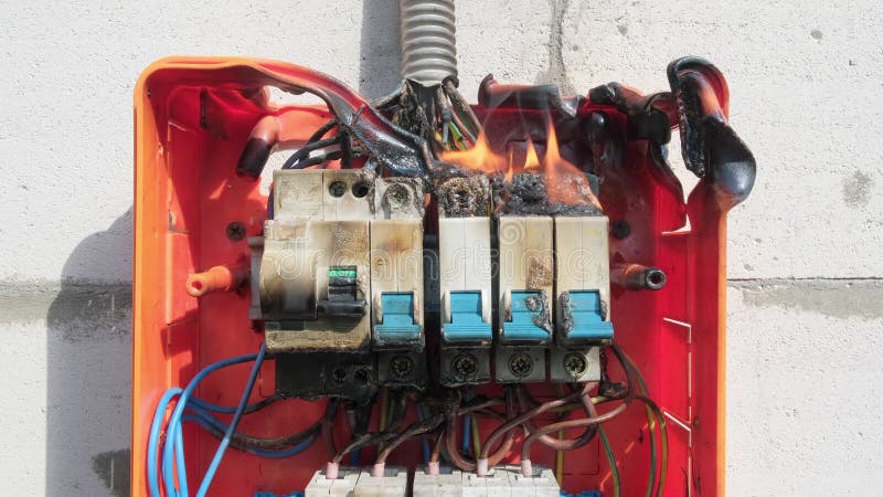 Burning Switchboard from Overload or Short Circuit on the Wall Stock ...
