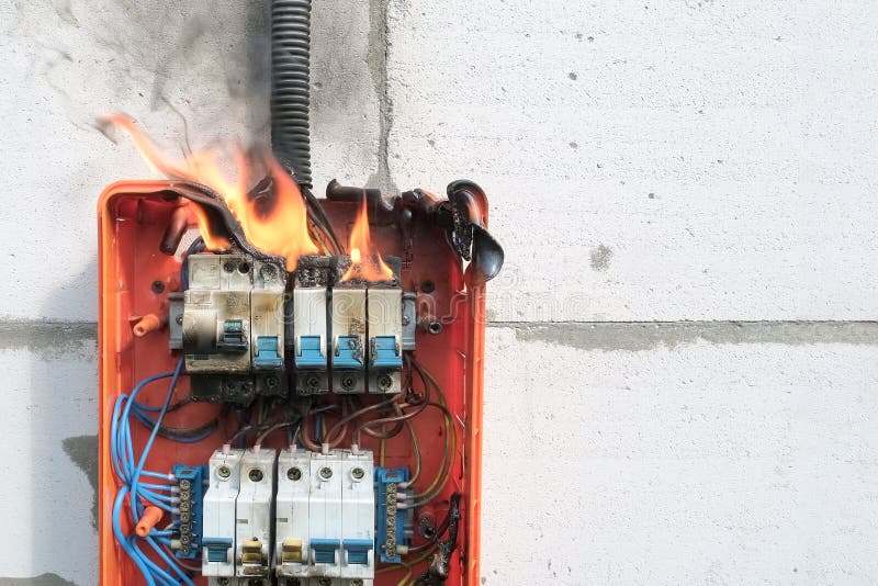 Burning Switchboard from Overload or Short Circuit on the Wall Stock ...