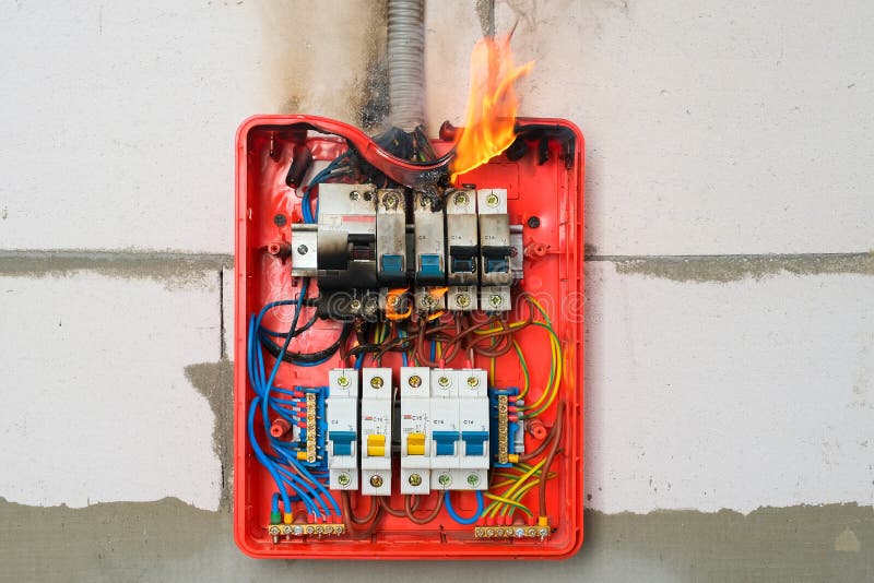 Burning Switchboard from Overload or Short Circuit on Wall Closeup ...