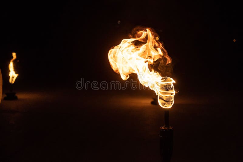 Burning torch at night stock photo. Image of patio, burner - 110011766
