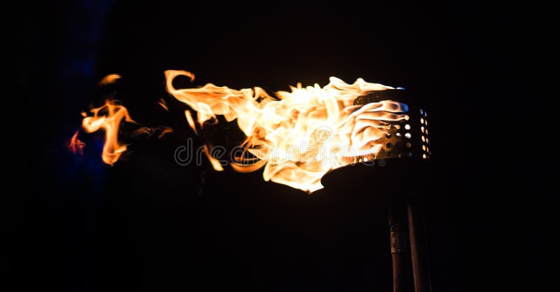 Burning Torch in the Night at Black Background Stock Image - Image of ...