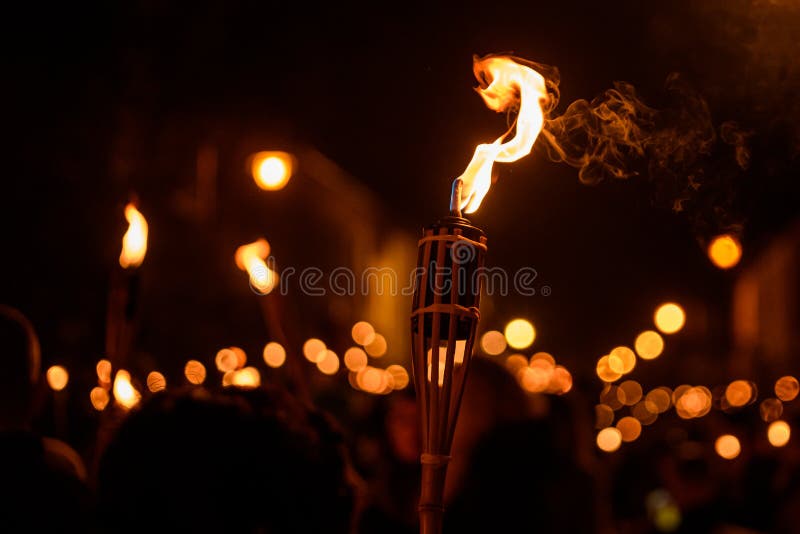Burning Torch at Night in a Procession. Bokeh Stock Image - Image of ...