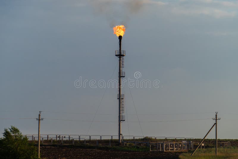 Burning Torch at the Refinery Against the Grey Sky Stock Photo - Image ...
