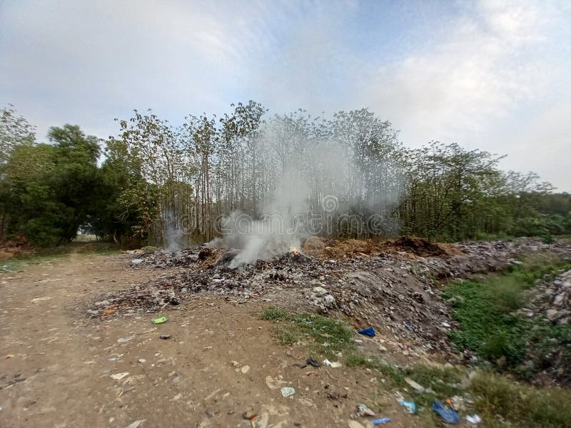 Burning trash in landfills stock photo. Image of destruction - 228763118