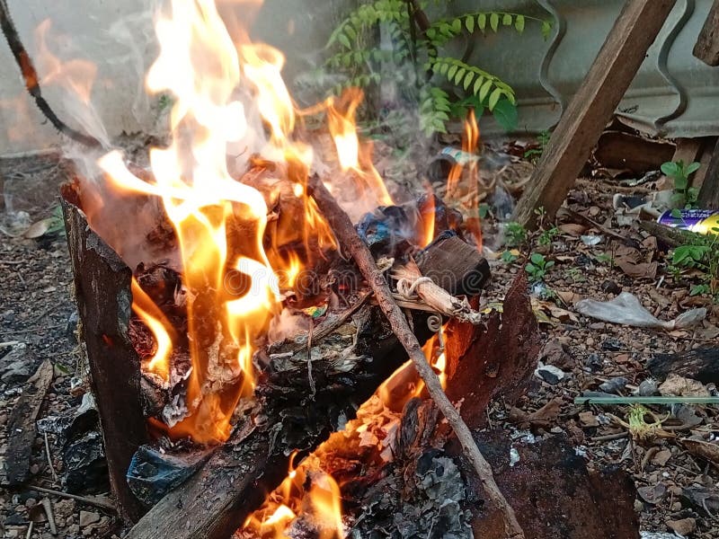 Burning Trash in an Open Field, Causing Pollution and Smoke Stock Image ...