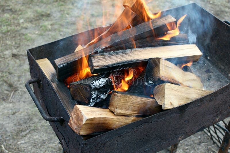 Burning wood in a brazier stock image. Image of neutral - 24231217
