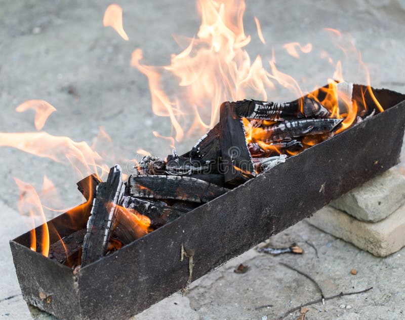 Burning wood in a brazier stock image. Image of temperature - 110993609