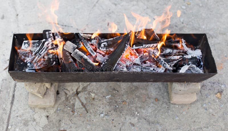 Burning wood in a brazier stock photo. Image of temperature - 110993664
