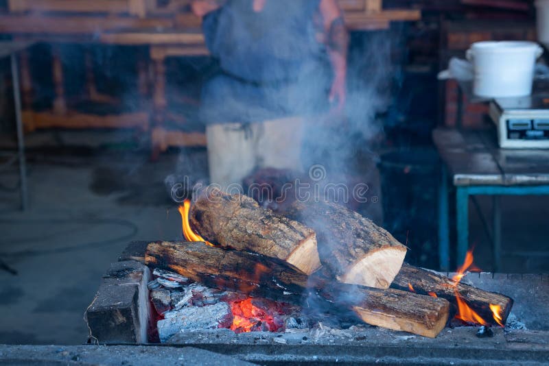 Burning Wood and Coal for the Grill on the Market Stock Photo - Image ...